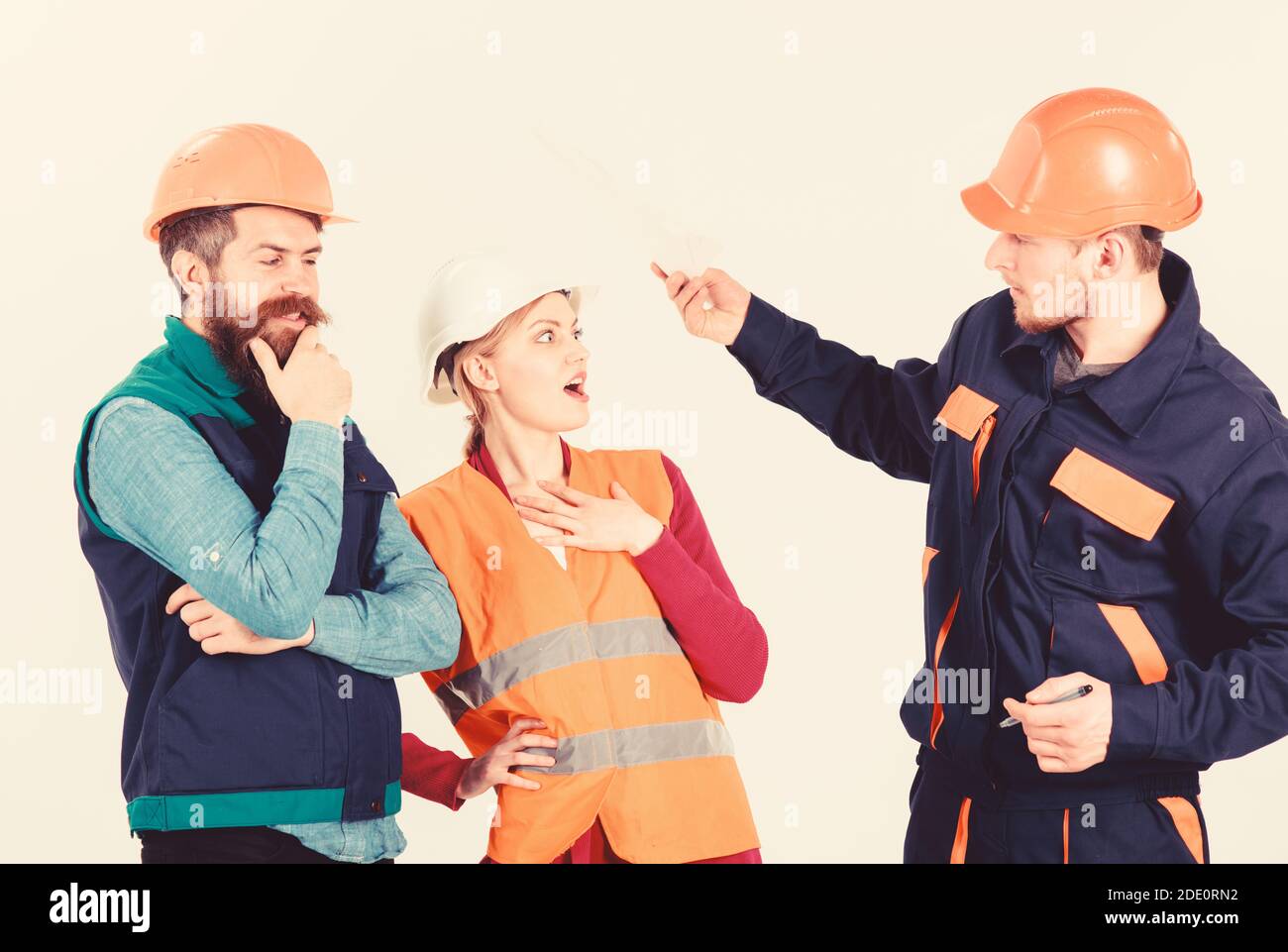 Labor dispute concept. Builders and engineer arguing, misunderstanding ...