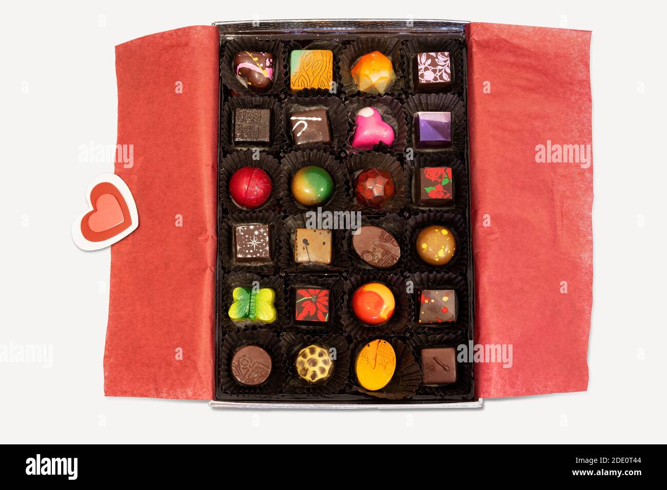 Handmade chocolates in a box, isolated on white background. View from ...