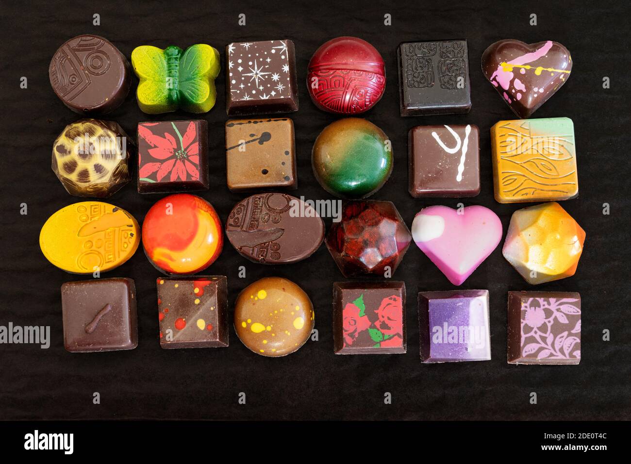 Handmade chocolates on a dark background. View from above Stock Photo ...