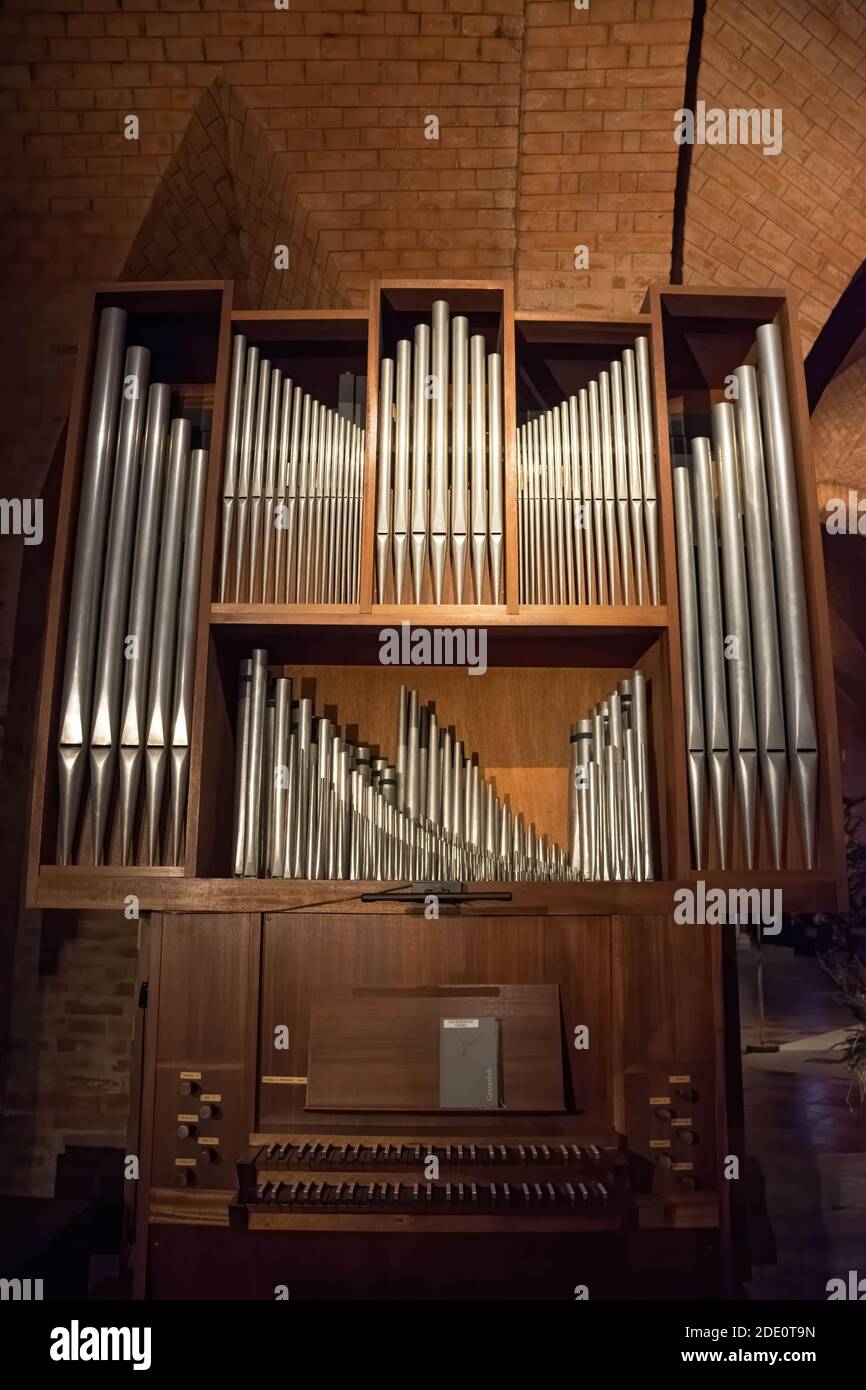 A historic pipe organ inside a church. Old musical instrument ...