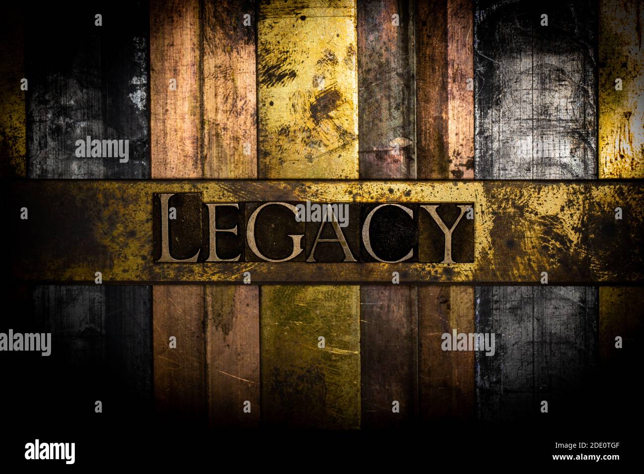 Legacy text on grunge textured copper and gold background Stock Photo ...