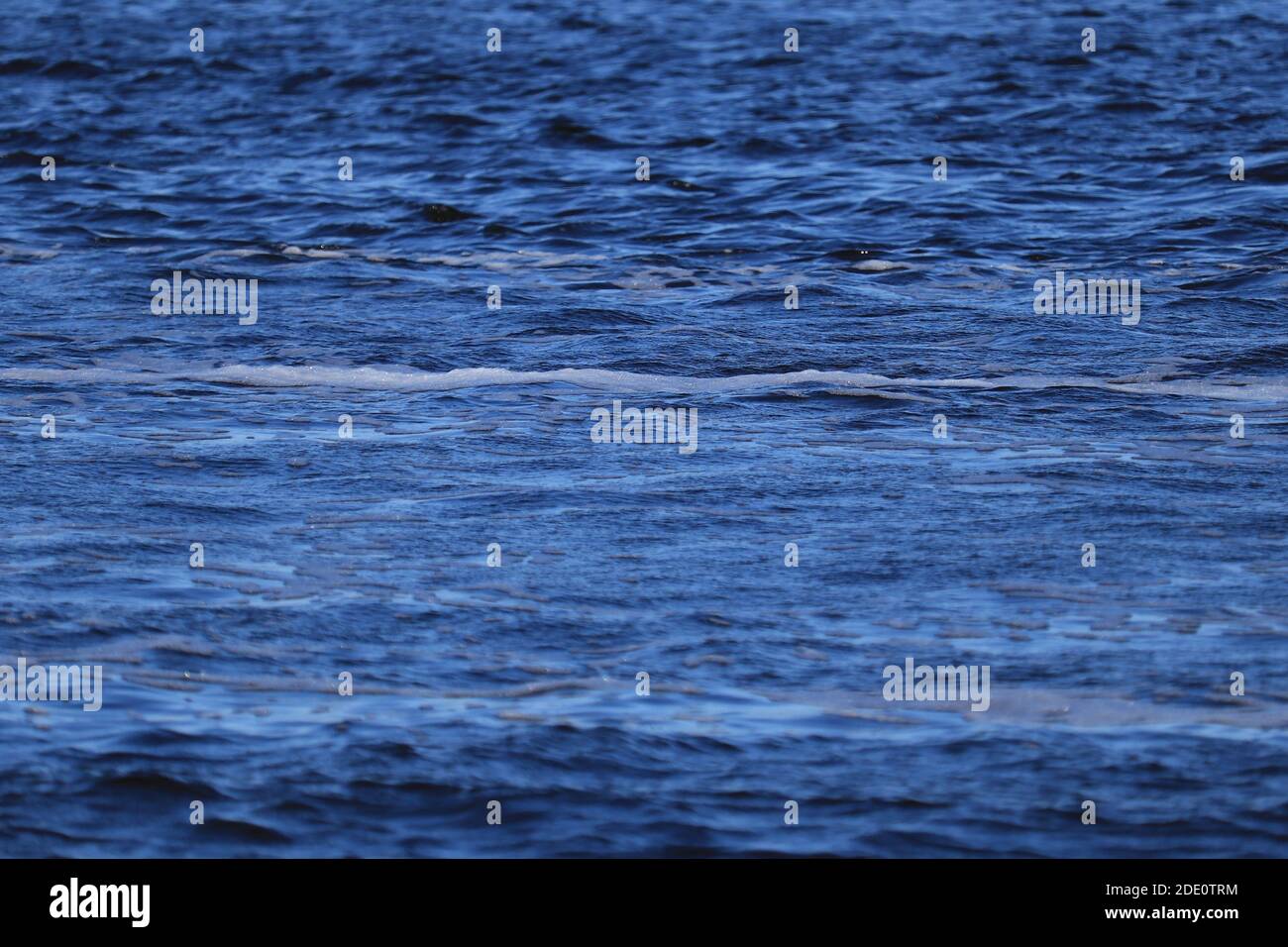 Small waves on the ocean surface, ripples on the water surface, bright ...