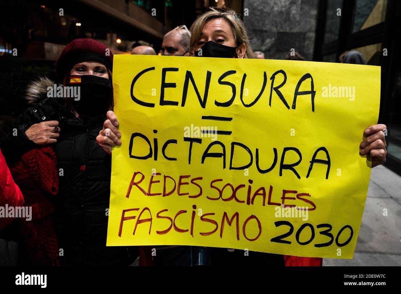 Madrid, Spain. 27th Nov, 2020. A woman wearing a face mask to protect ...