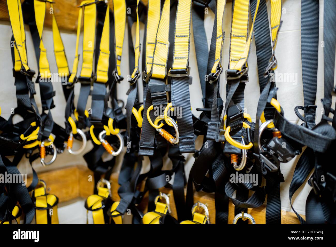 Professional climbing equipment hanging at amusement park warehouse ...
