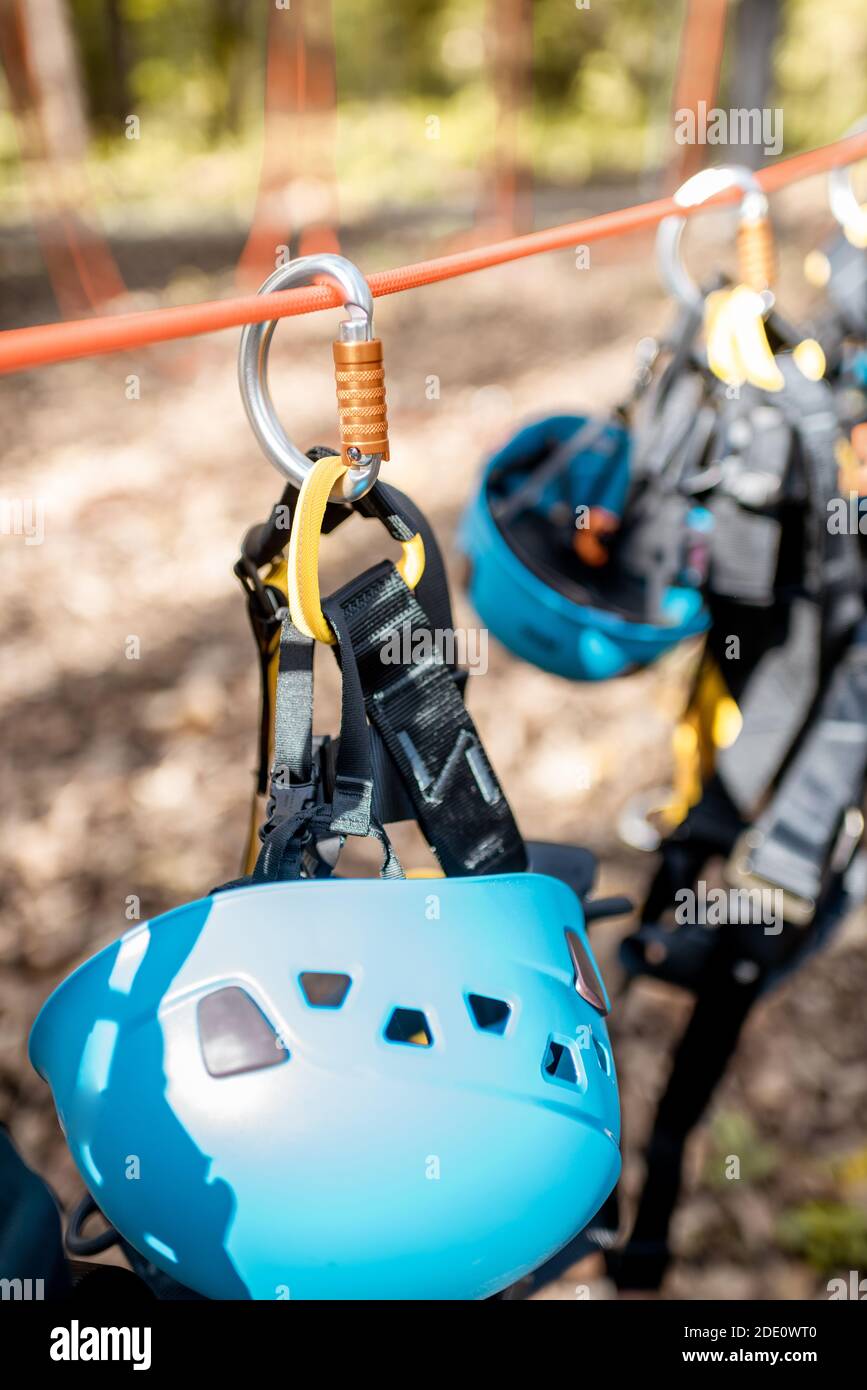 Climbing equipment hanging on the rope at amusement park outdoors Stock ...