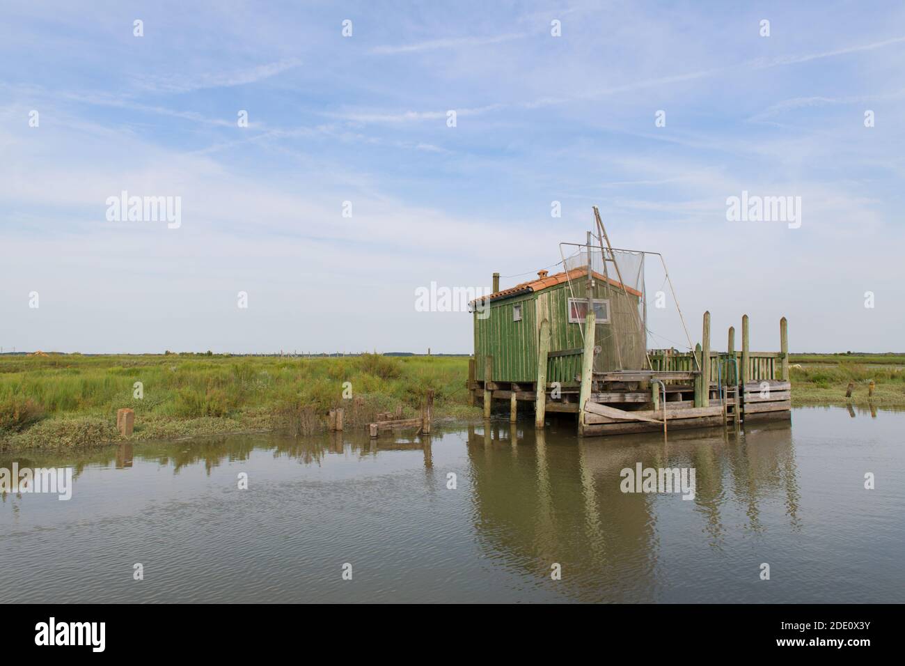 Green cabin at wooden boat dock in landscape at French Charente Stock ...