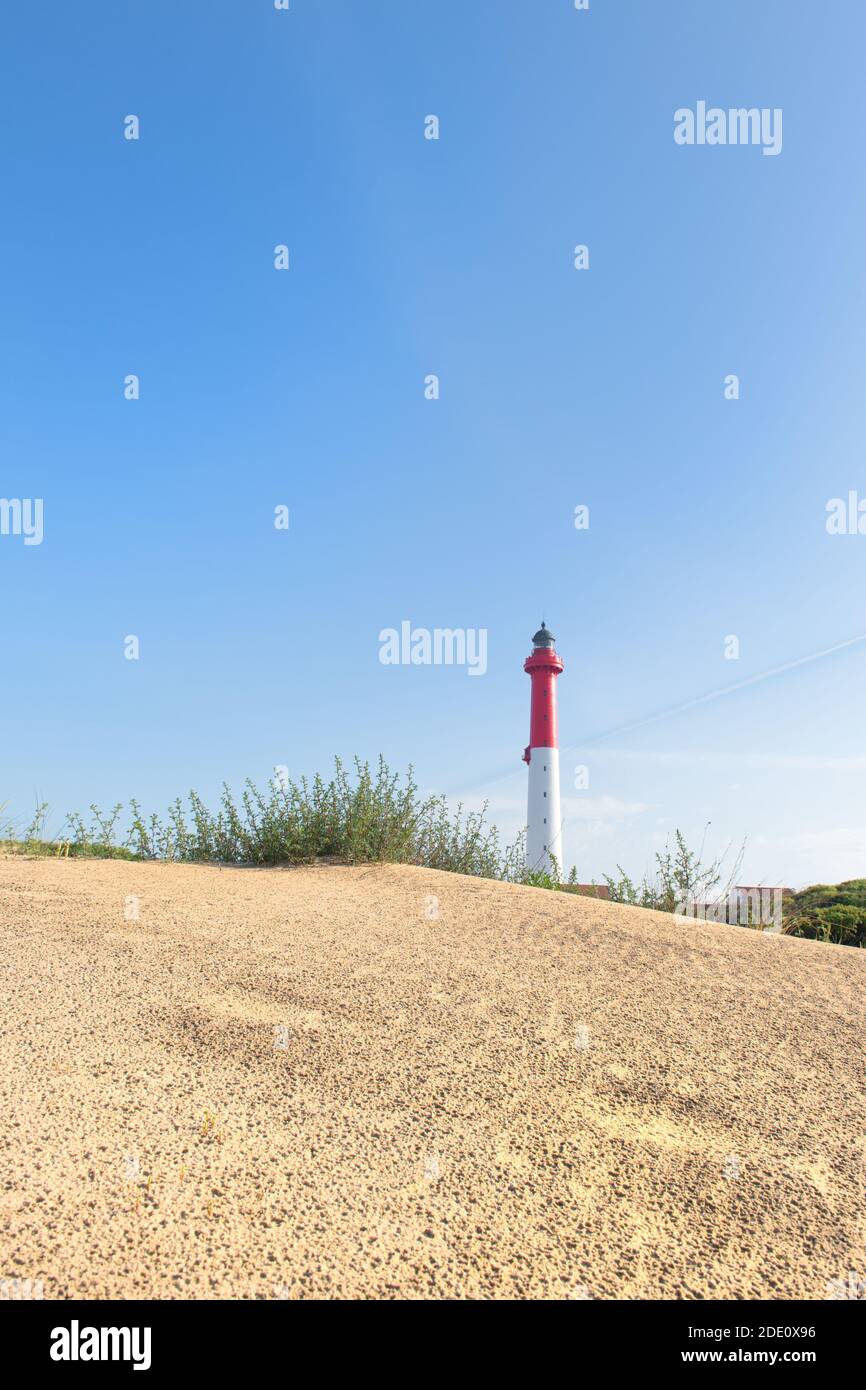 Lighthouse red and white at the French west beach Stock Photo - Alamy