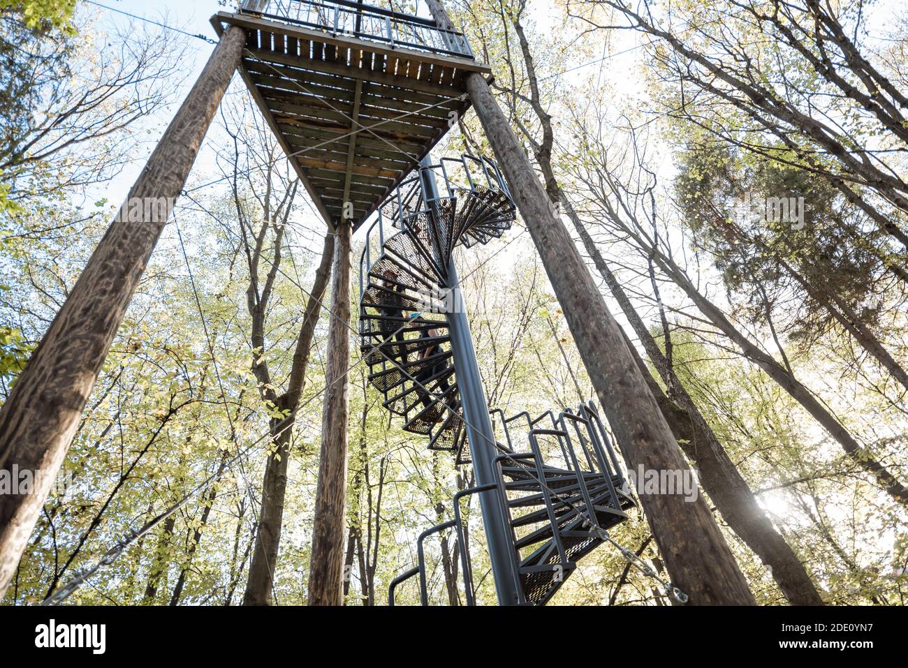 Rope Jumping tower with spiral staircase and people climbing up Stock ...