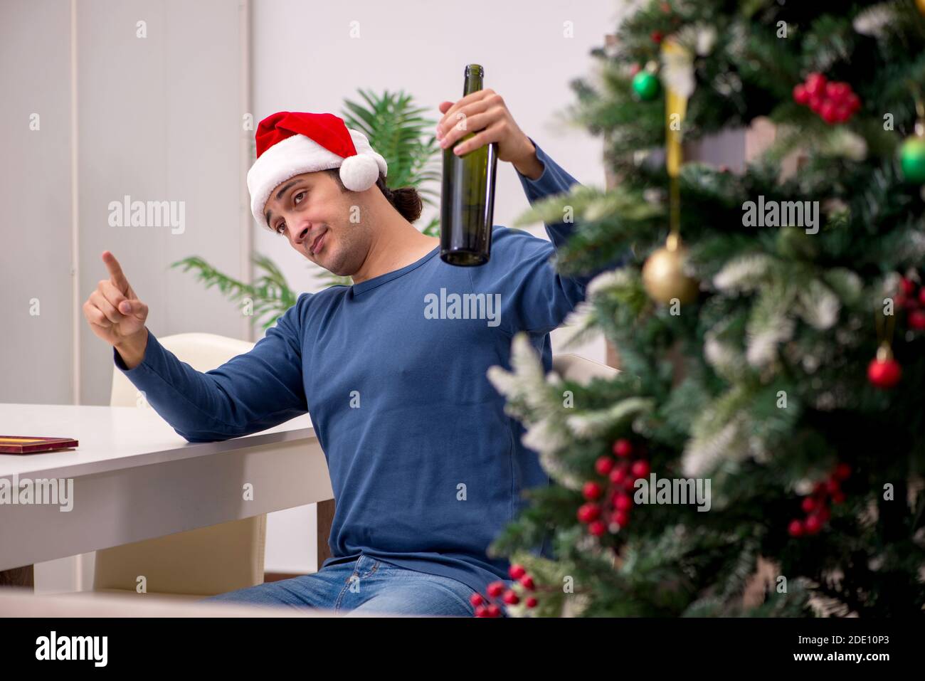 Young man celebrating new year alone at home Stock Photo - Alamy