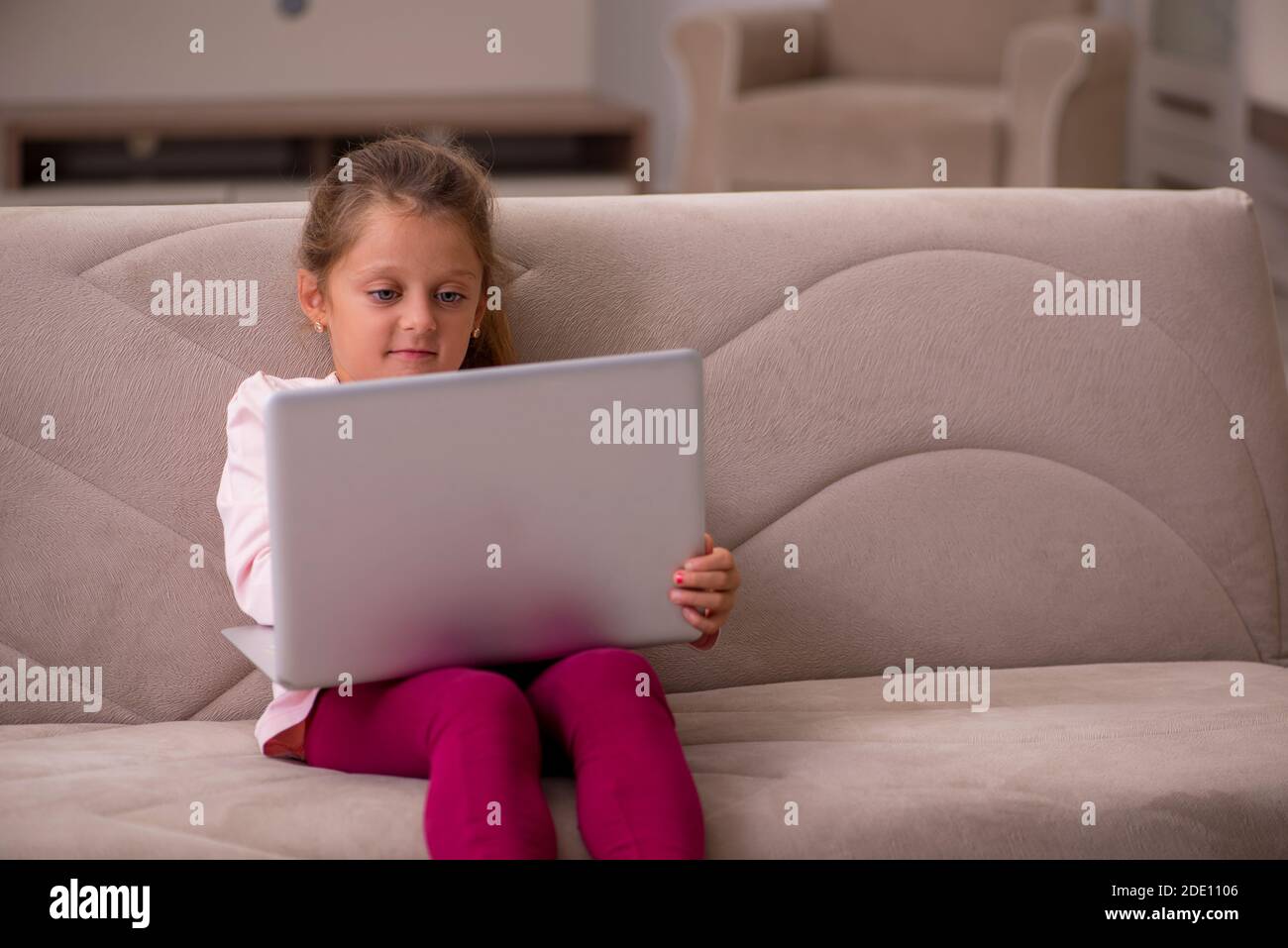 Little girl in tele-education concept at home Stock Photo - Alamy