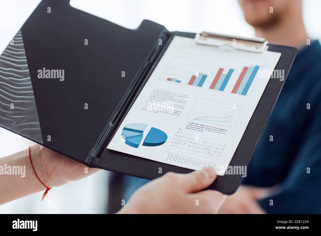 close up. financial chart is in the hands of a young employee Stock ...