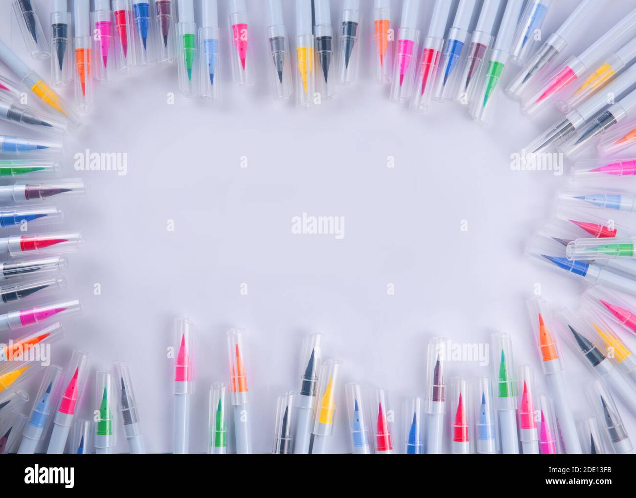 Frame made of many pens and markers of different colors Stock Photo - Alamy