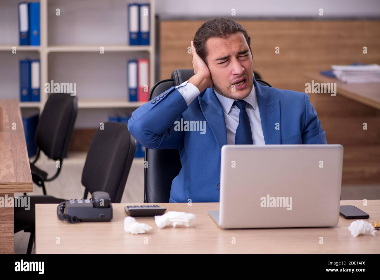 Sick businessman employee suffering at workplace Stock Photo - Alamy