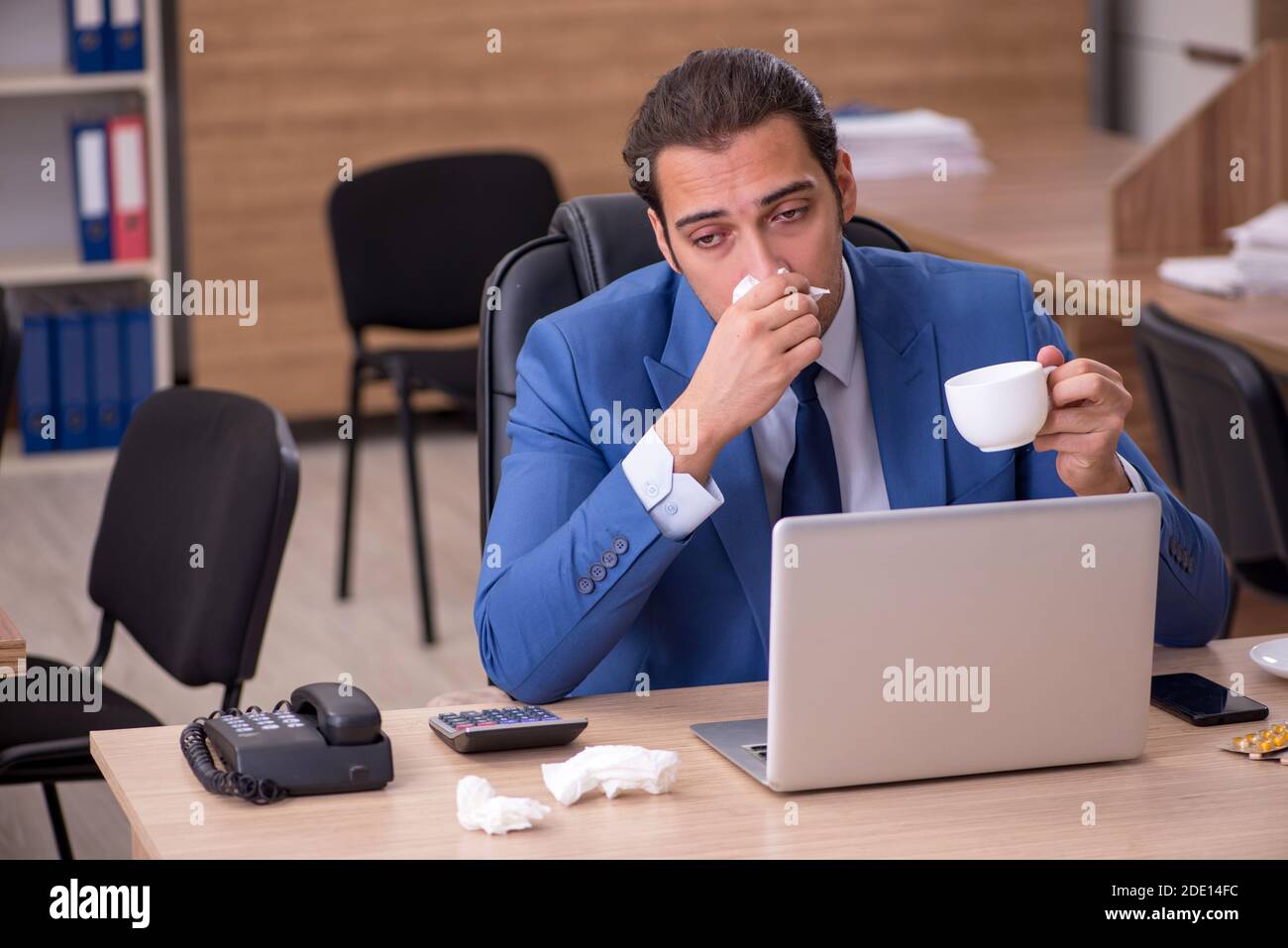 Sick businessman employee suffering at workplace Stock Photo - Alamy