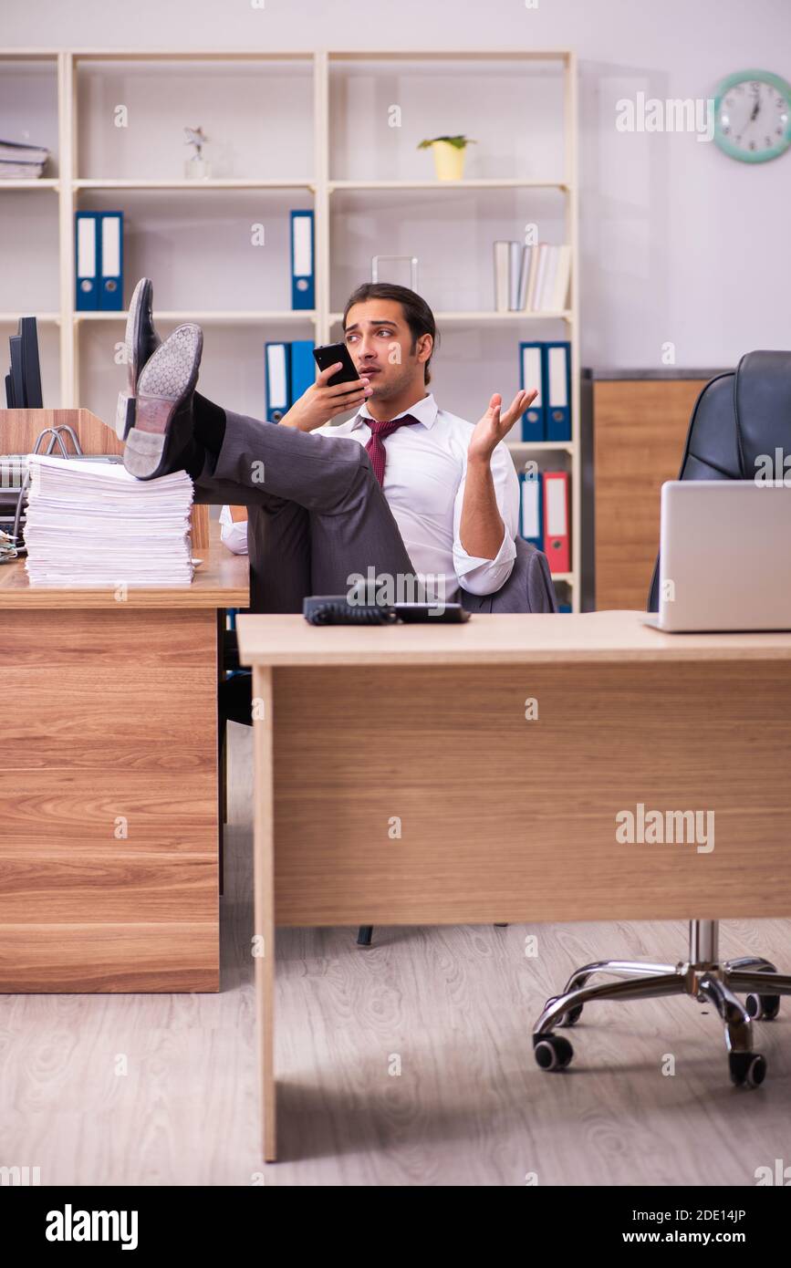 Young employee extremely tired with excessive work Stock Photo - Alamy