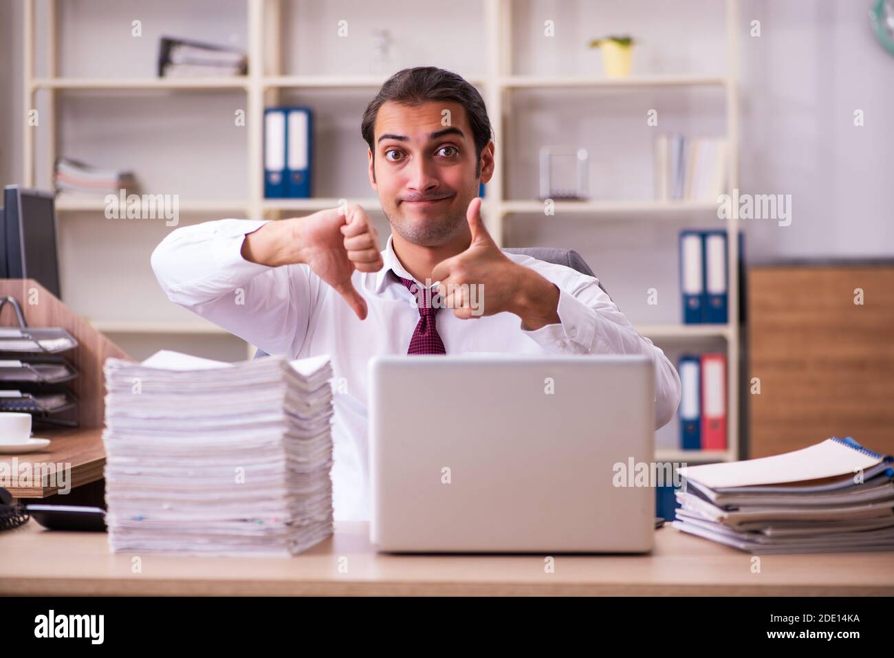 Young employee extremely tired with excessive work Stock Photo - Alamy