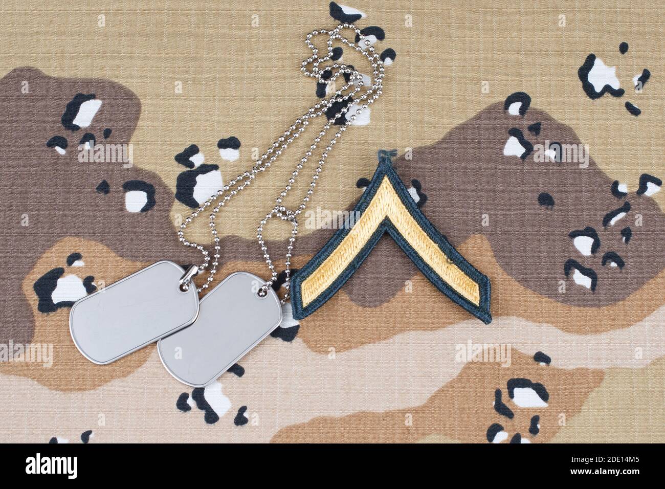 May 12, 2018. US ARMY Private rank patch and dog tags on Desert Battle ...