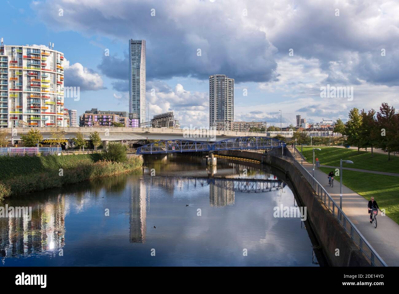 Cyclists on the towpath of the River Lea, Stratford, East London ...