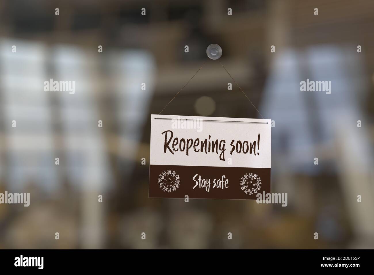 Reopening the economy after corona virus concept: A sign on a ...