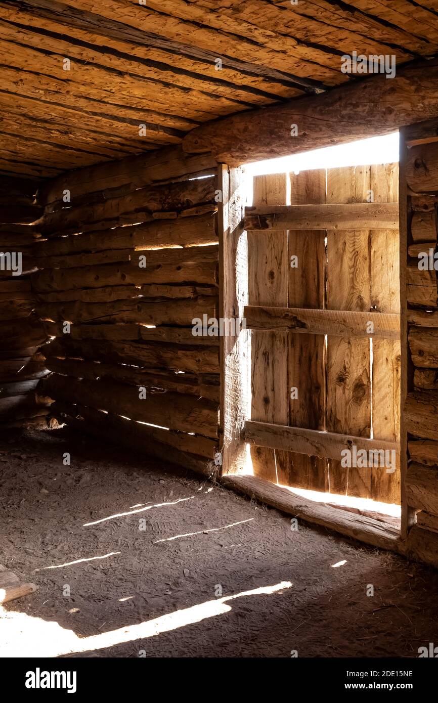 Door in barn with light streaming through cracks at Caroline Lockhart ...