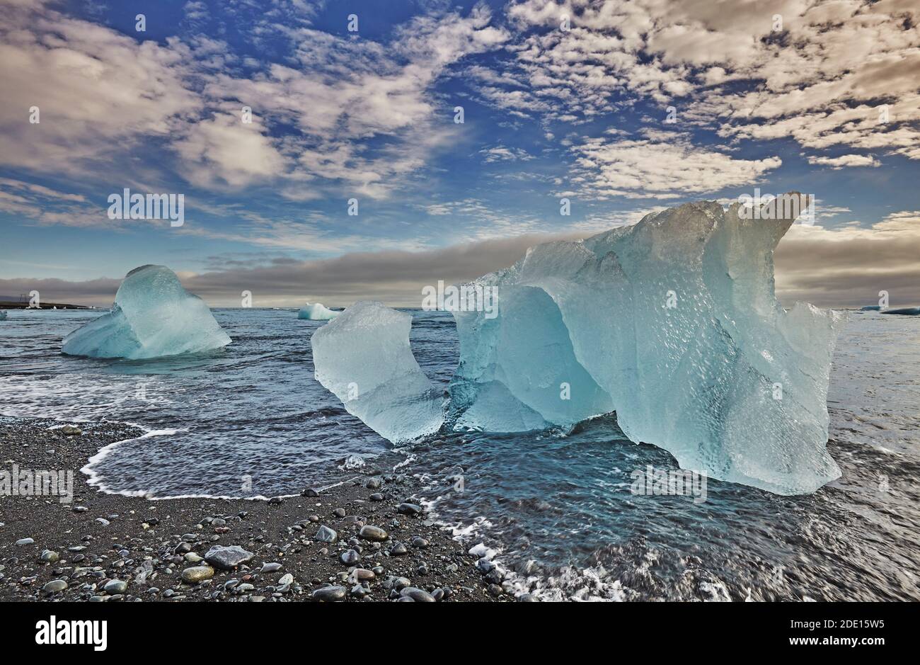 Melting glacial ice, carved from the Vatnajokull icecap, on the beach ...