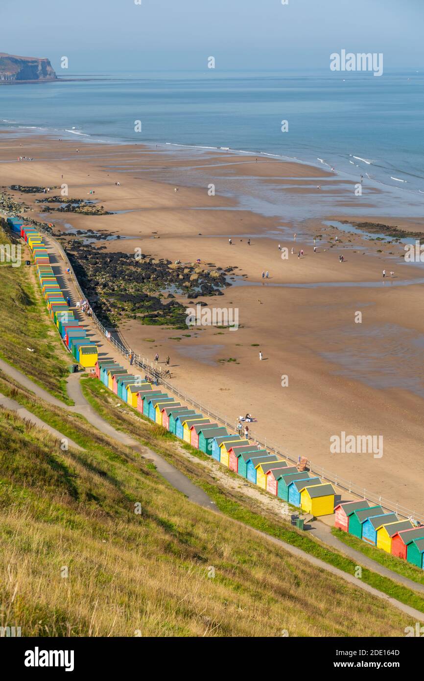 View of colourful beach huts on West Cliff Beach, Whitby, North ...