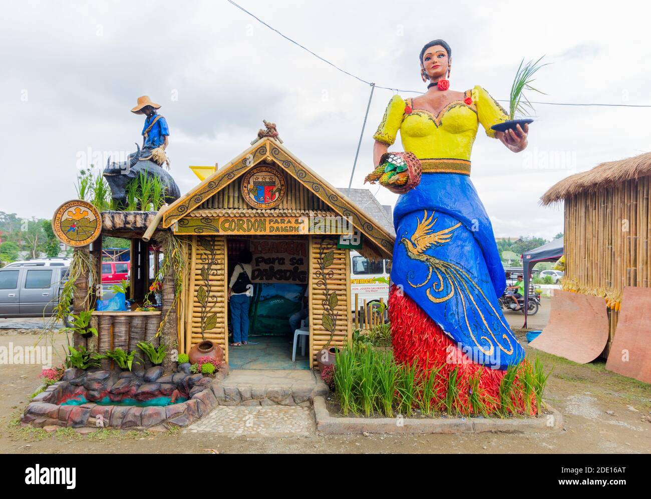 Colorful statue and house replica made from natural materials on ...