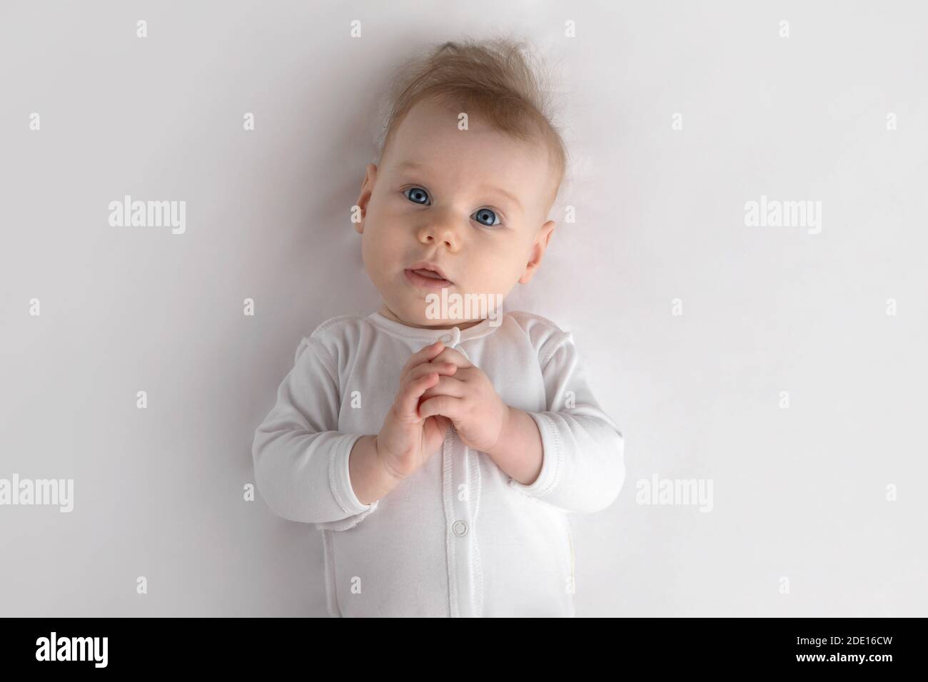 Baby in white hi-res stock photography and images - Alamy
