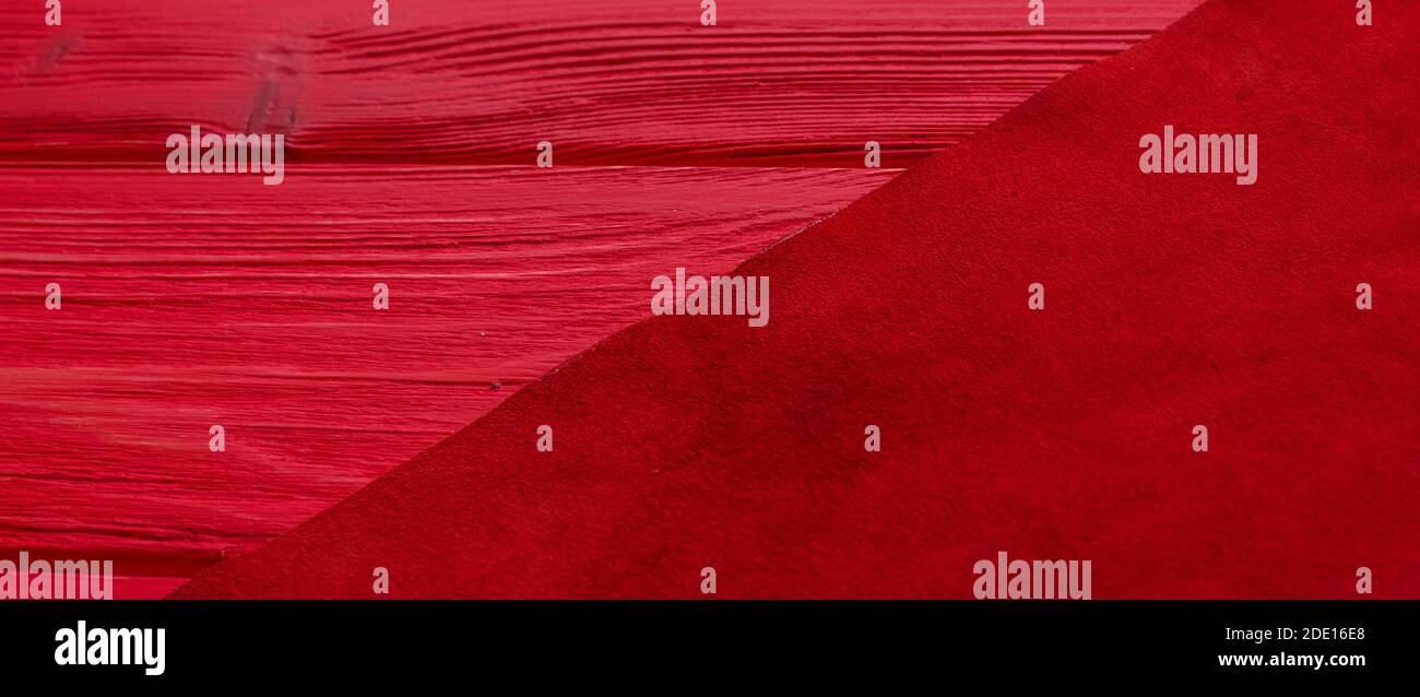 Red matte background of suede fabric, closeup. Wood red plank ...