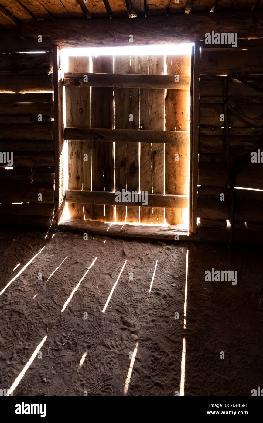 Door in barn with light streaming through cracks at Caroline Lockhart ...