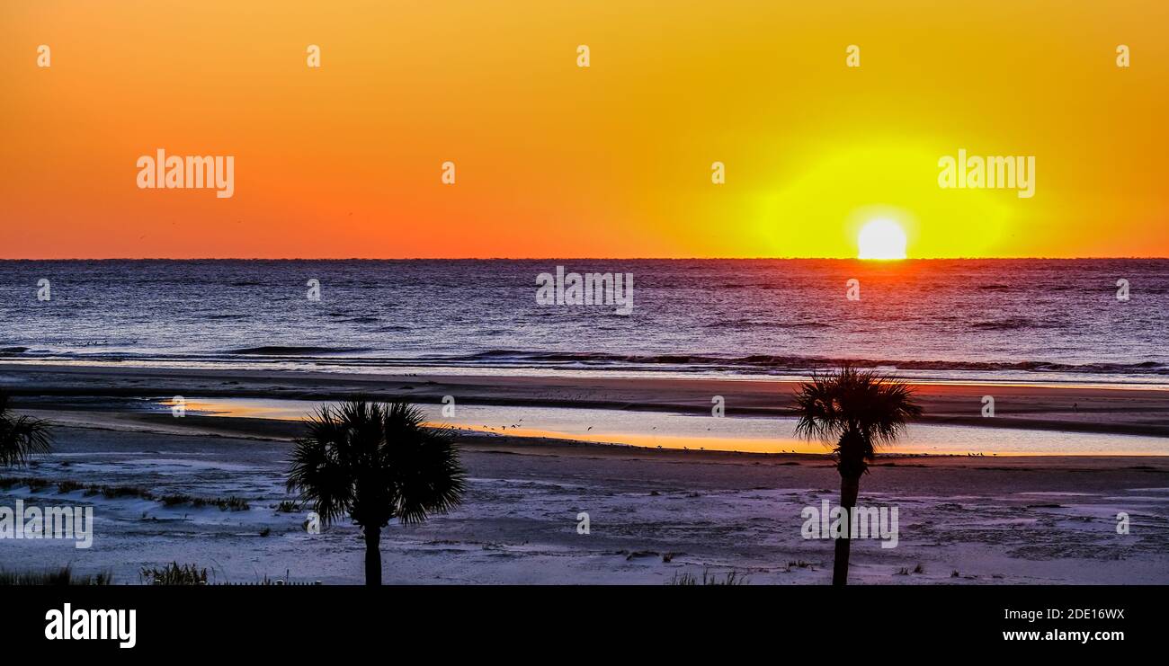 Sun Rising Beyond Beach Stock Photo - Alamy
