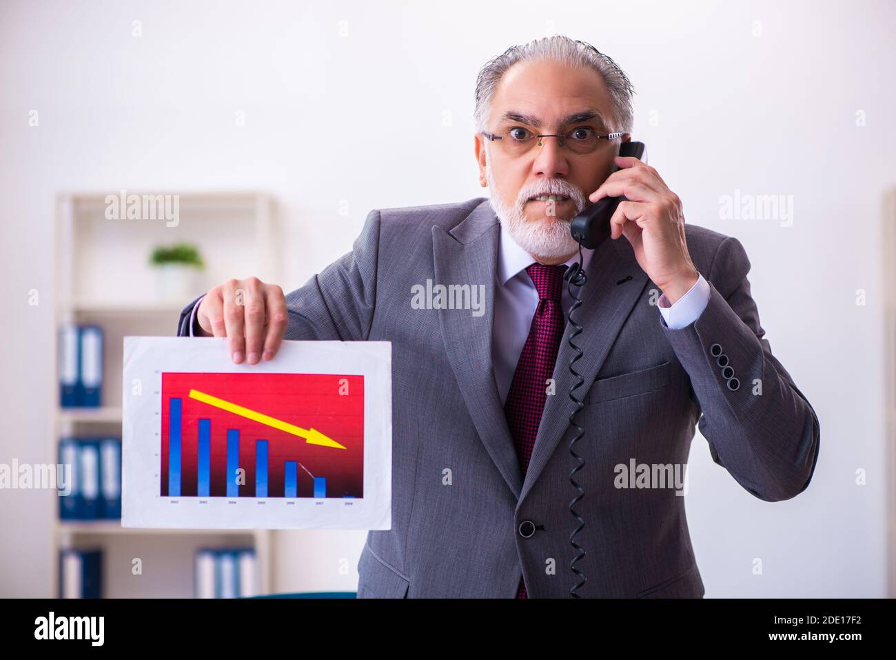 Experienced employee working in the office Stock Photo - Alamy