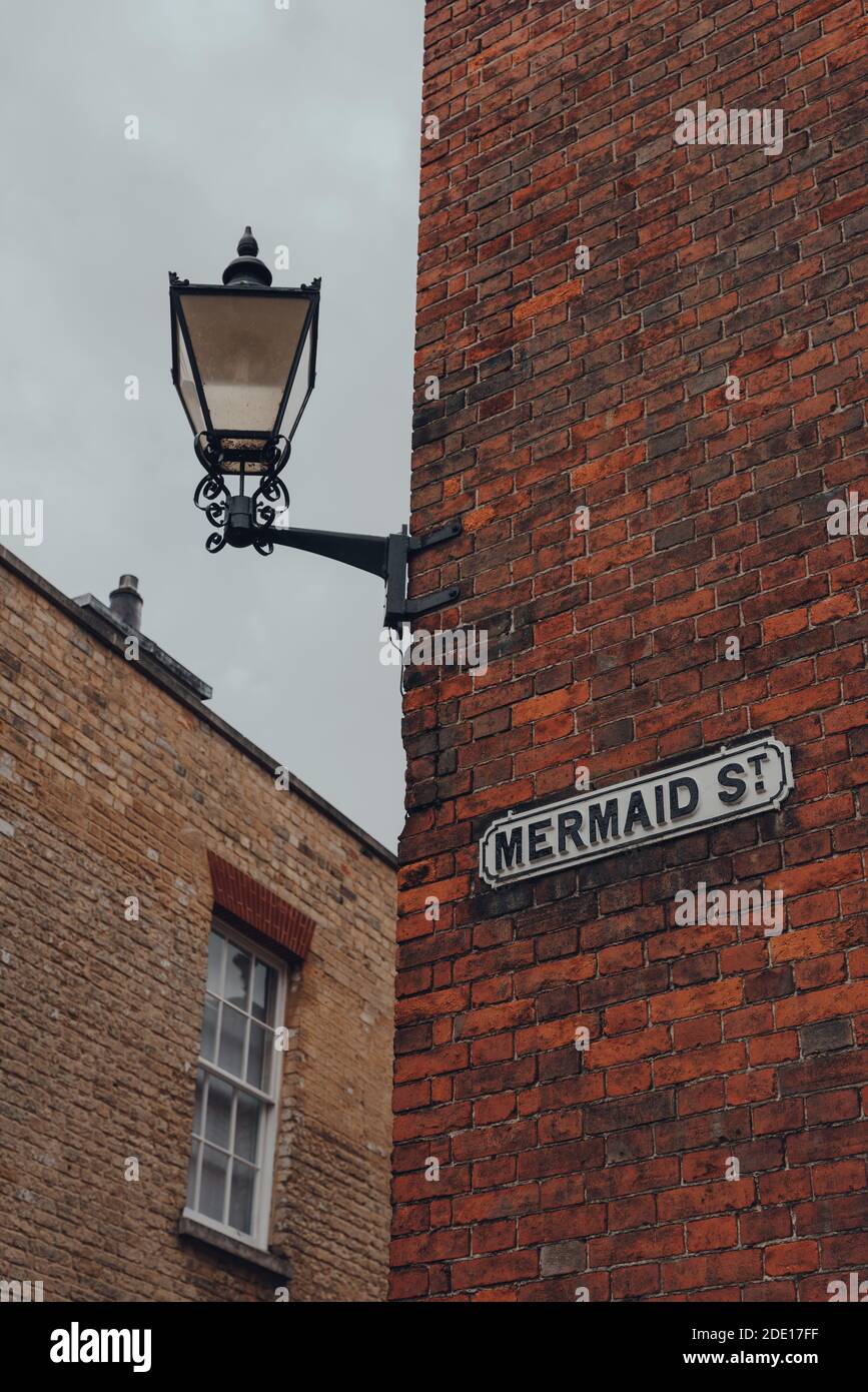 Street name sign on a brick wall of a building in Mermaid Street in Rye ...