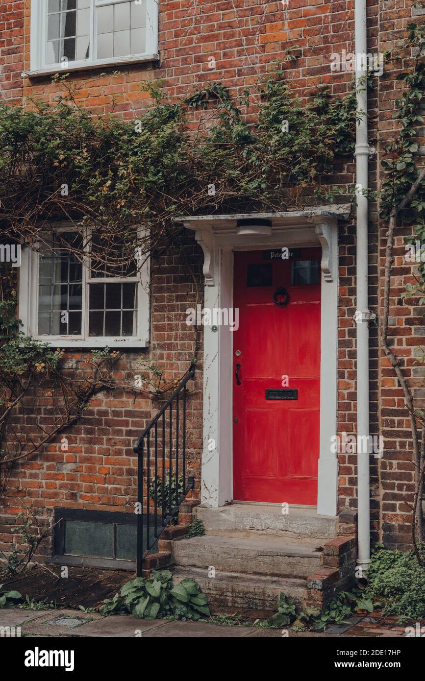 Rye, UK - October 10, 2020: Red front door of a traditional English ...