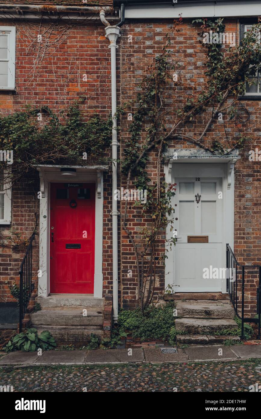 Rye, UK - October 10, 2020: Red and white front doors of traditional ...