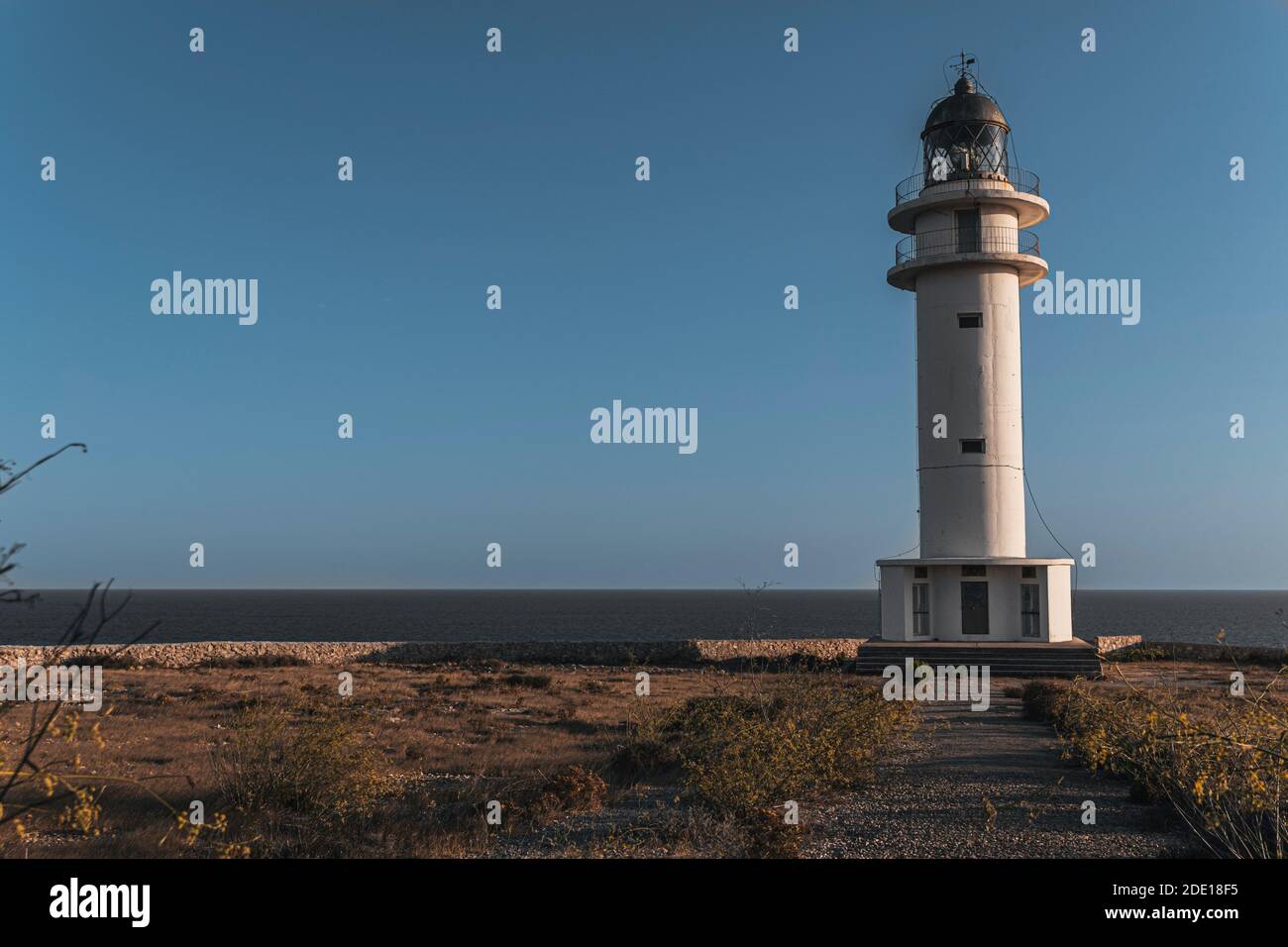 Front view with negative space of lighthouse in Formentera Stock Photo ...
