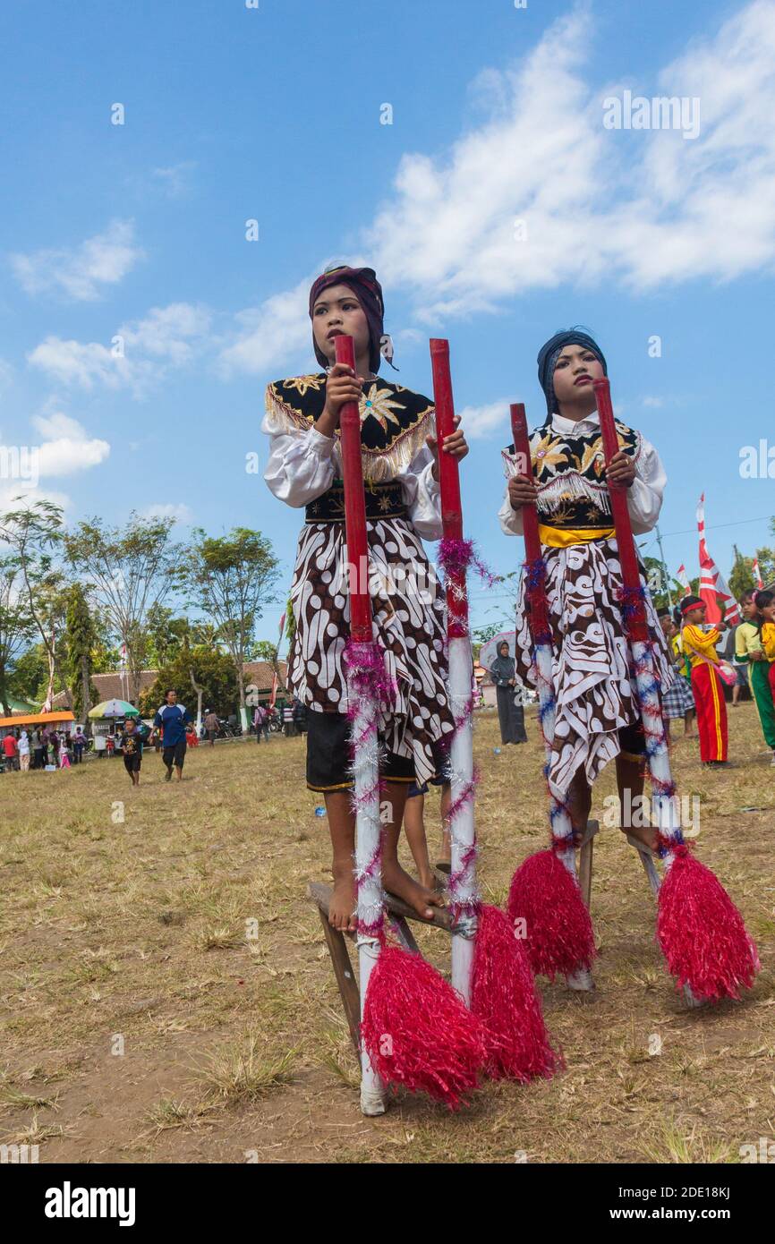 Participants of the annual stilts festival in Ledokombo village, Jember ...