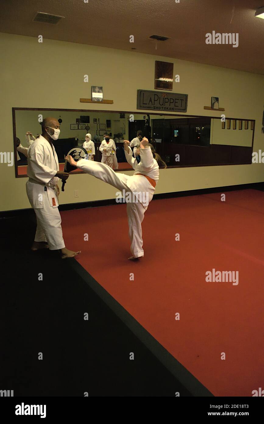 This action photo is of my daughter in her Karate class. Karate is a ...