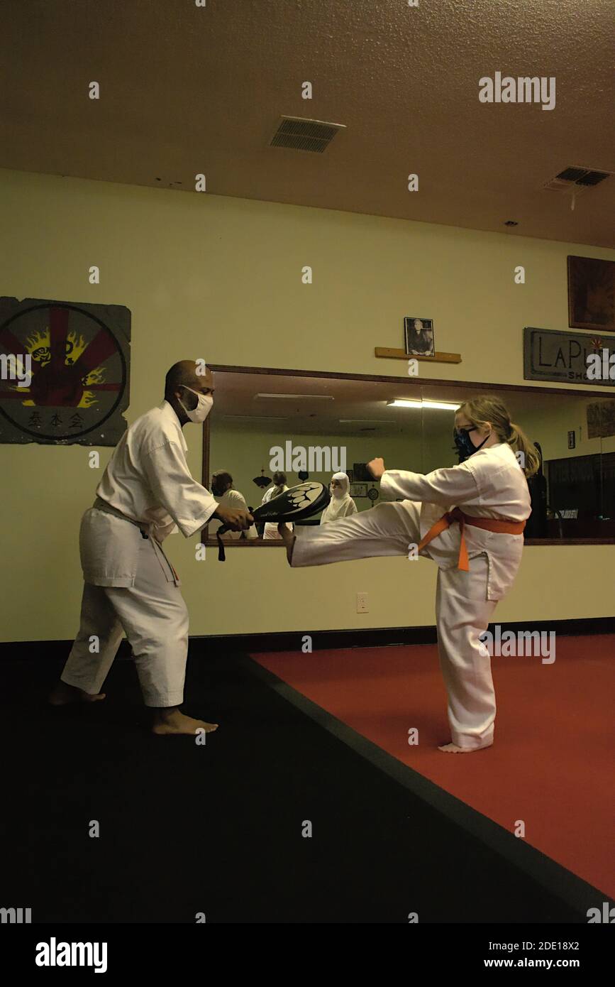 This action photo is of my daughter in her Karate class. Karate is a ...