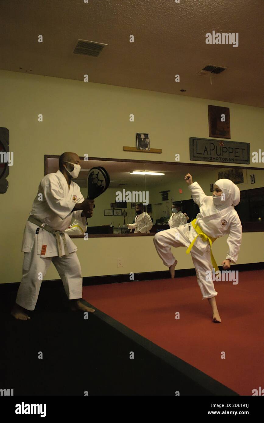 This action photo is of my daughter's Karate class. Karate is a martial ...