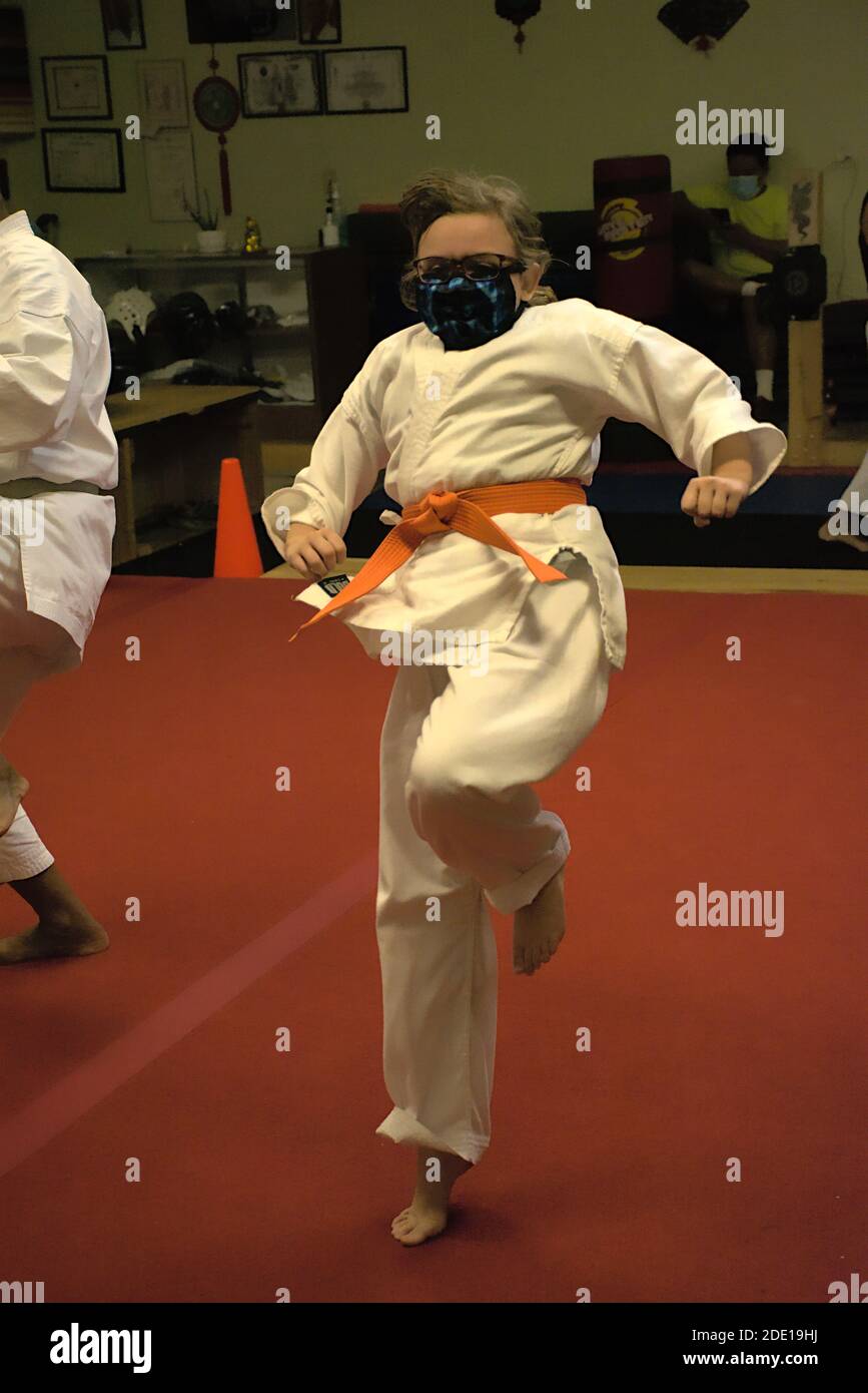 This action photo is of my daughter in her Karate class. Karate is a ...
