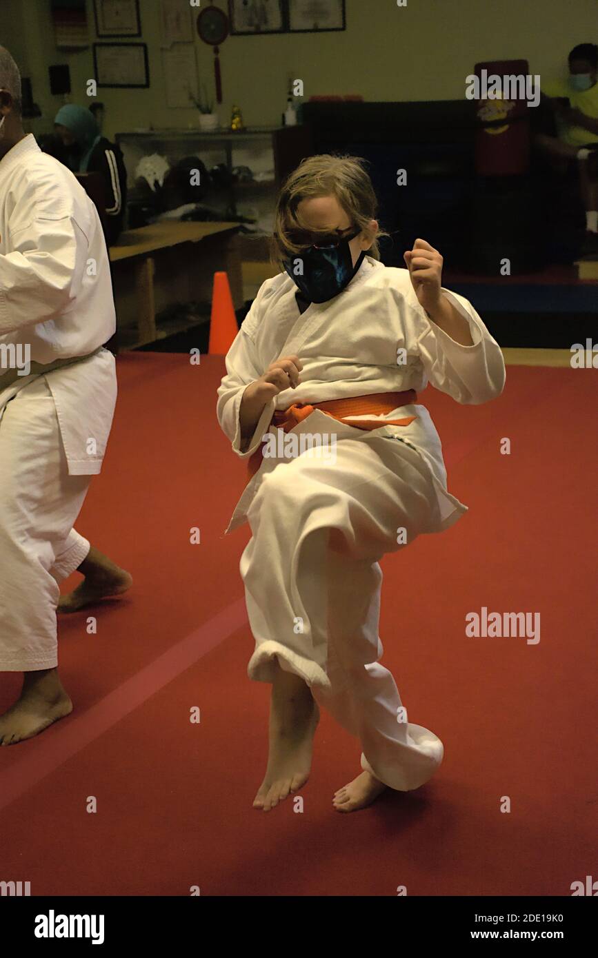 This action photo is of my daughter in her Karate class. Karate is a ...