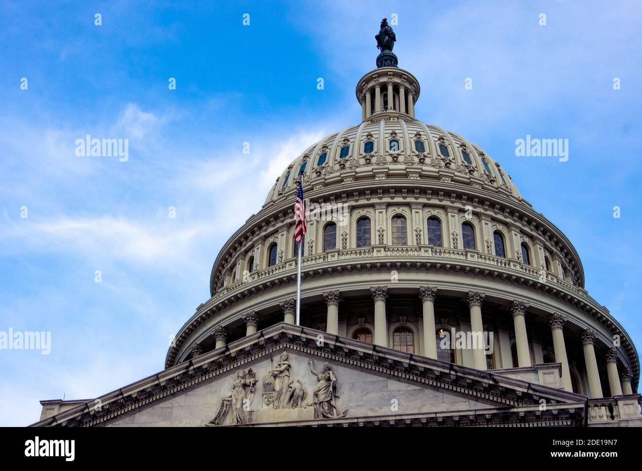 low angle view of American flag on United States Capitol building ...