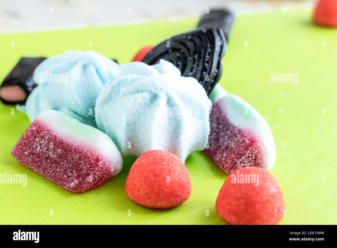 Colorful italian sweets for party: black licorice candies scattered ...