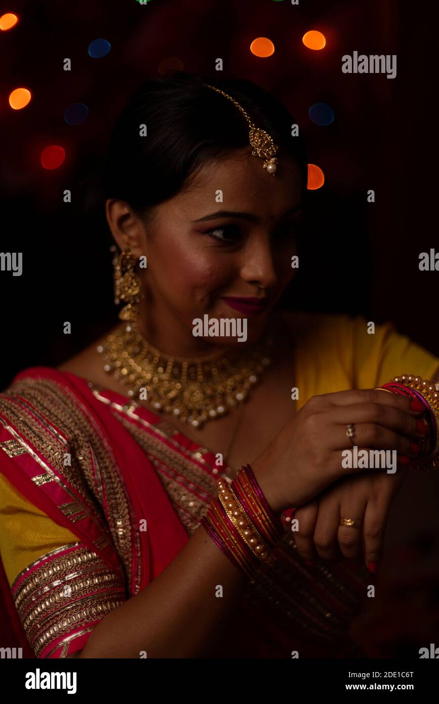 An Young And Beautiful Indian Bengali Woman Celebrating Diwali In