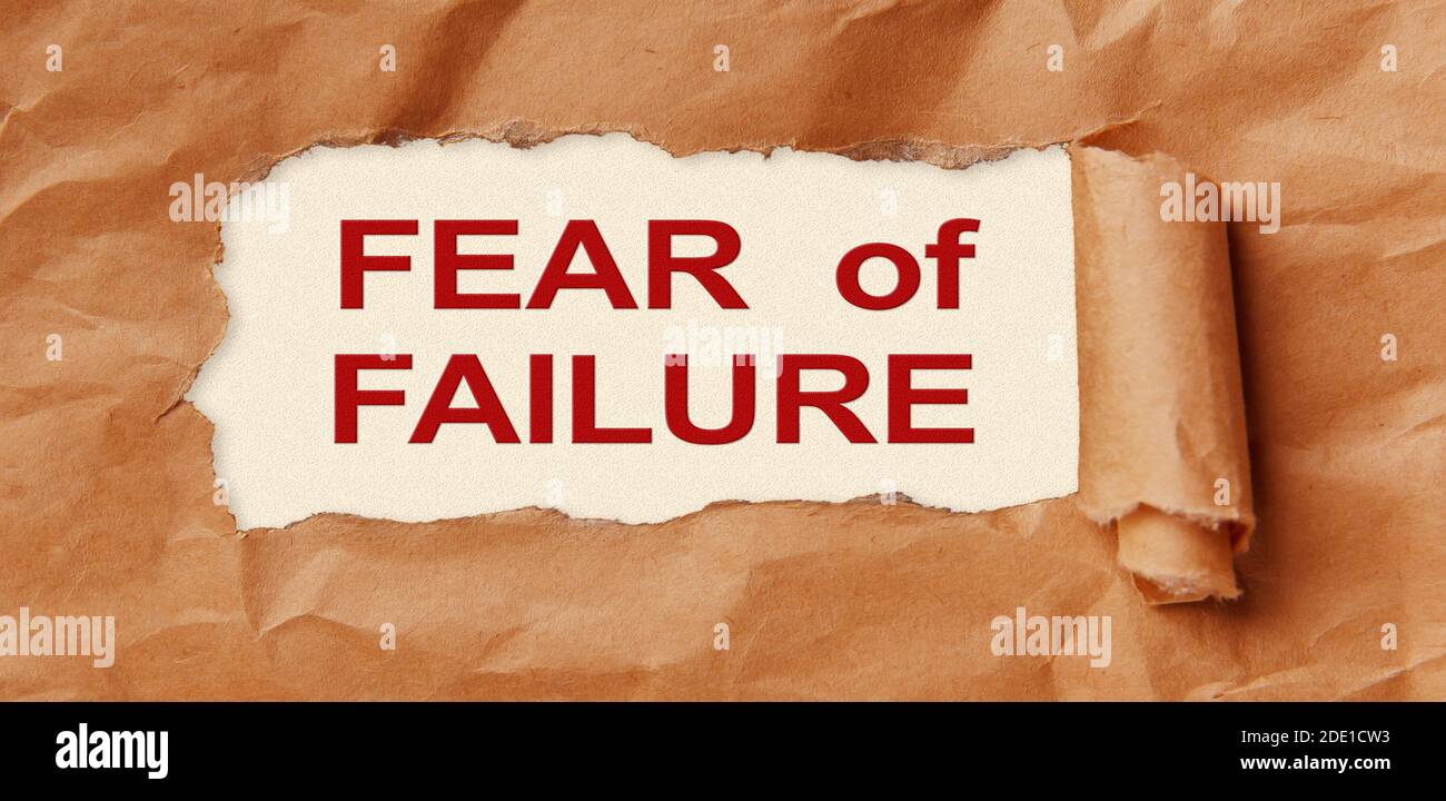 Text FEAR OF FAILURE appearing behind torn brown paper Stock Photo - Alamy