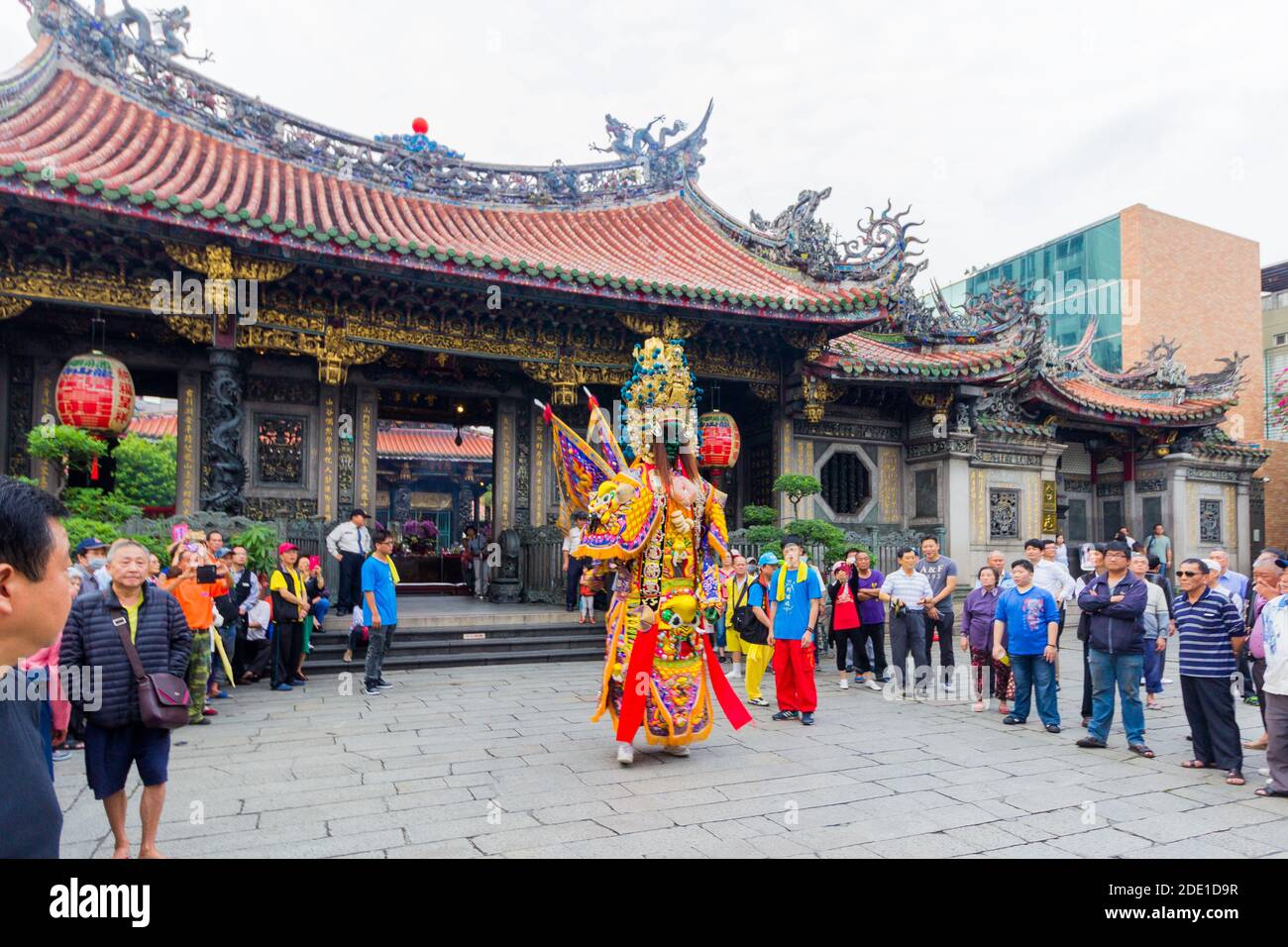 A religious parade during the Bao Sheng Cultural Festival that ...