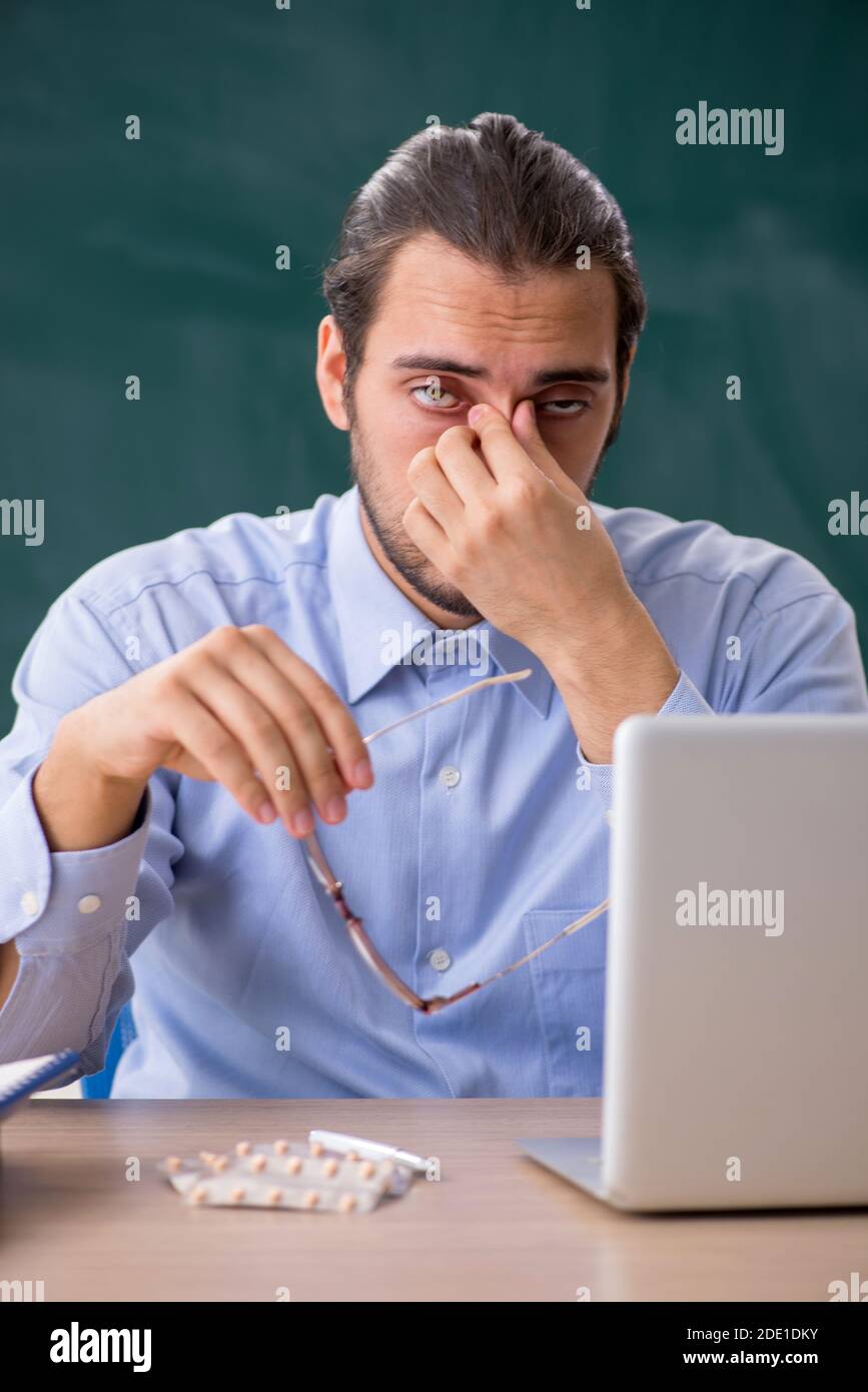 Sick teacher in the classroom hi-res stock photography and images - Alamy