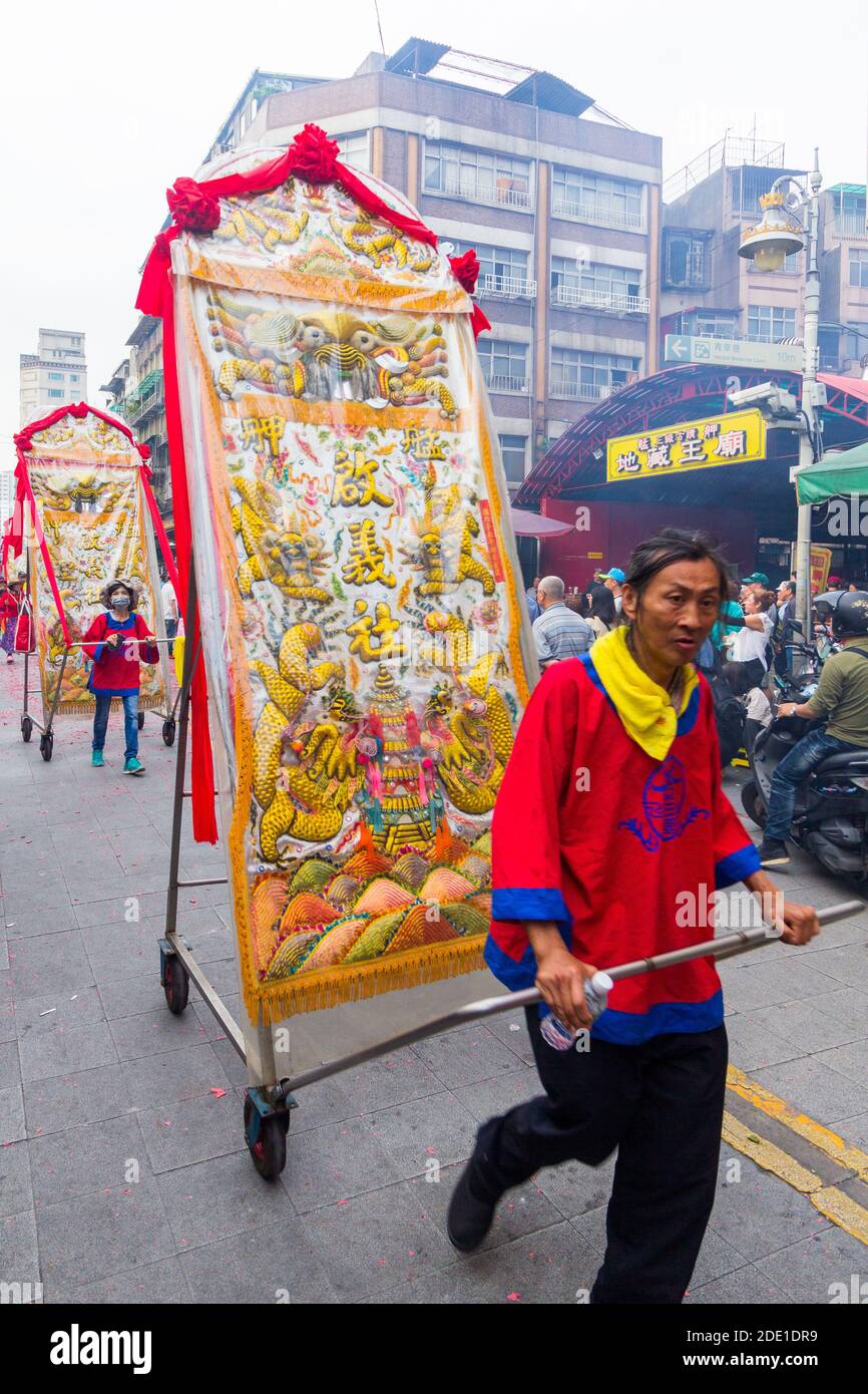 A religious parade during the Bao Sheng Cultural Festival that ...