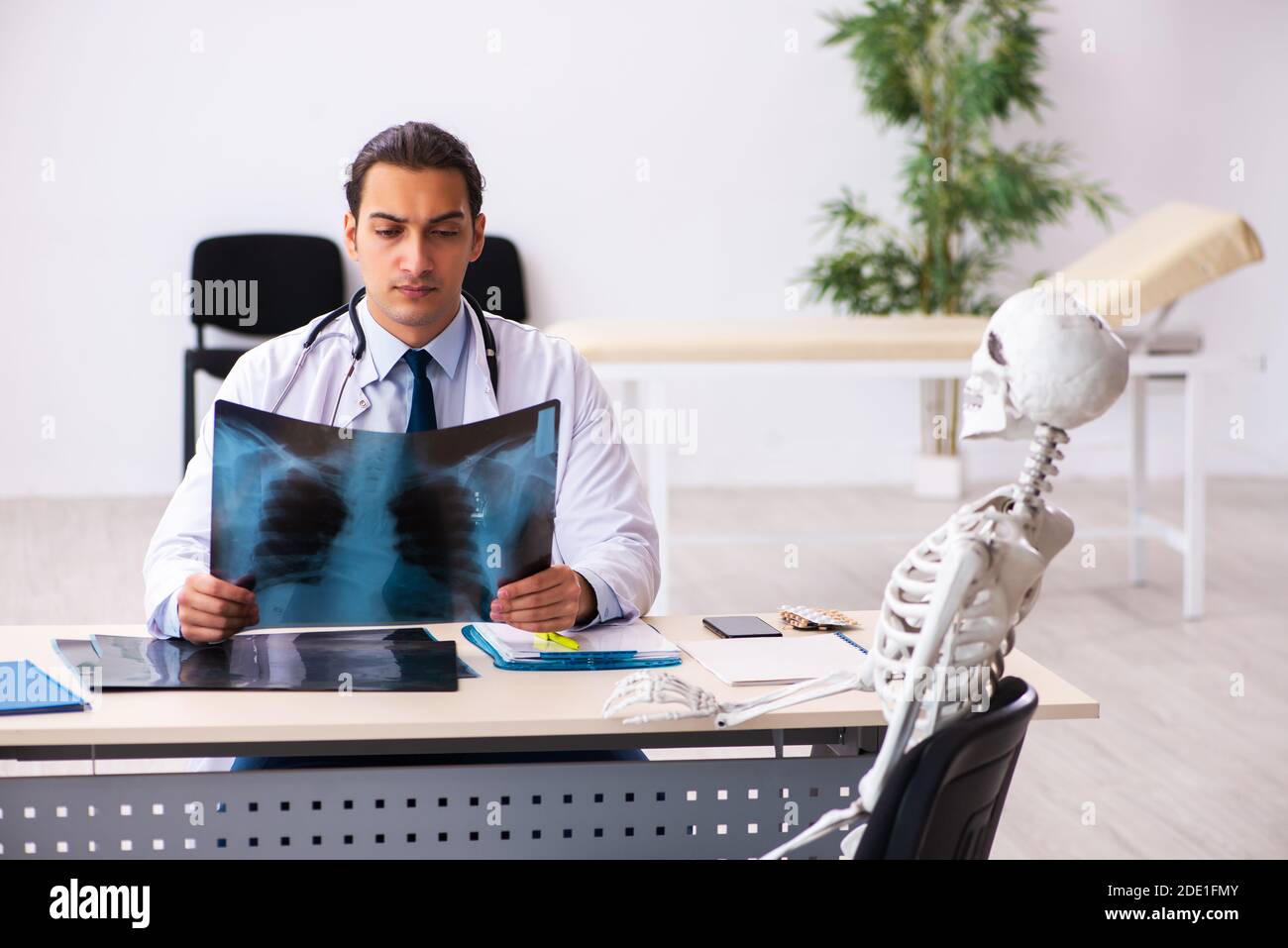 Young doctor radiologist and skeleton patient in the clinic Stock Photo ...